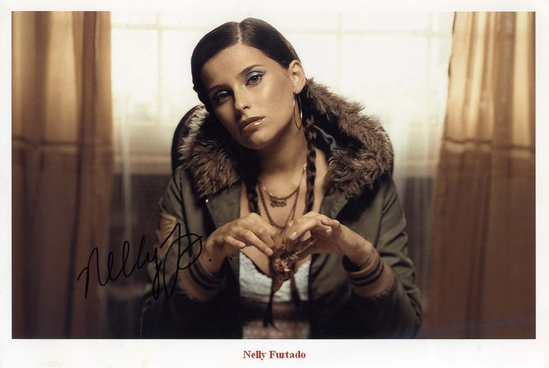 Nelly Furtado autograph, IP signed photograph